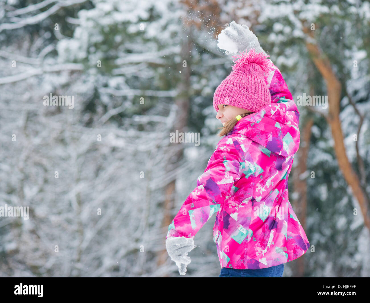 Child play in snow on winter day Stock Photo - Alamy
