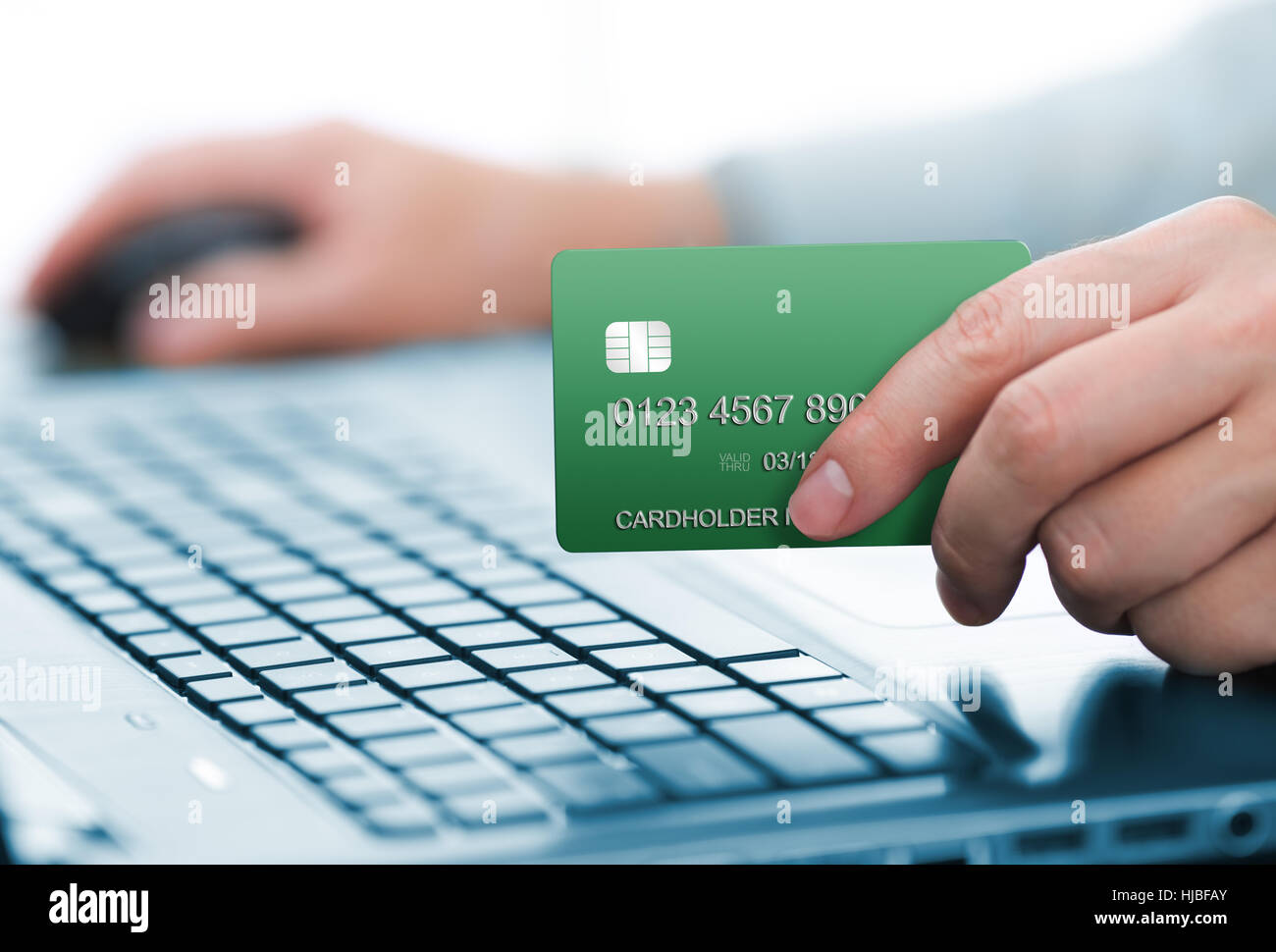 Man holding green payment card Stock Photo - Alamy