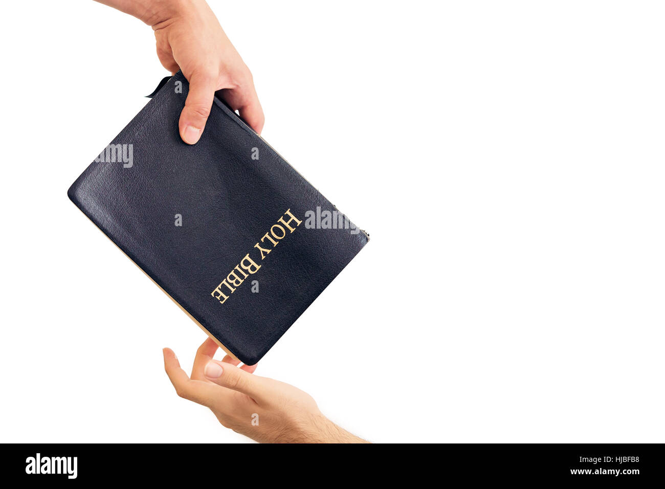 Male hand giving Bible and evangelizing someone Stock Photo - Alamy