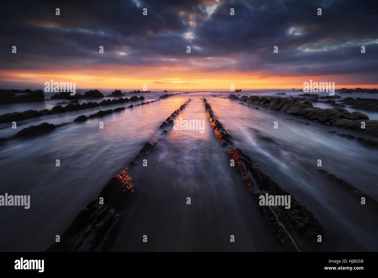 flysch rocks in barrika beach at the sunset Stock Photo - Alamy
