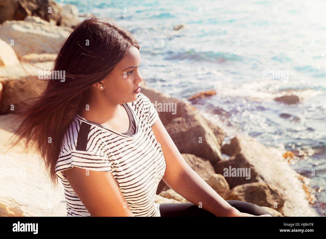 Beautiful young girl thinking in nature Stock Photo - Alamy