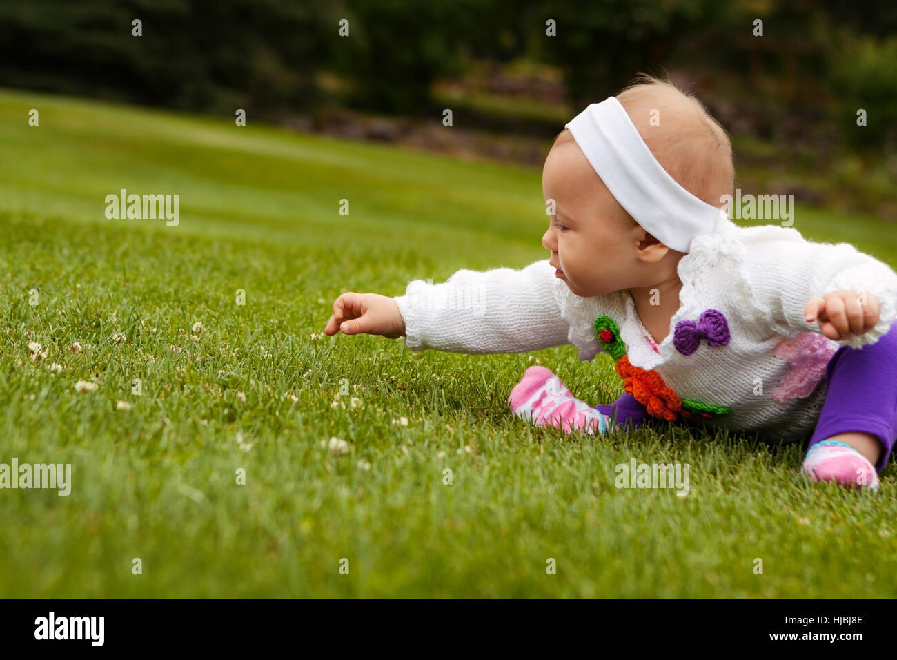 Baby sitting playing hi-res stock photography and images - Alamy