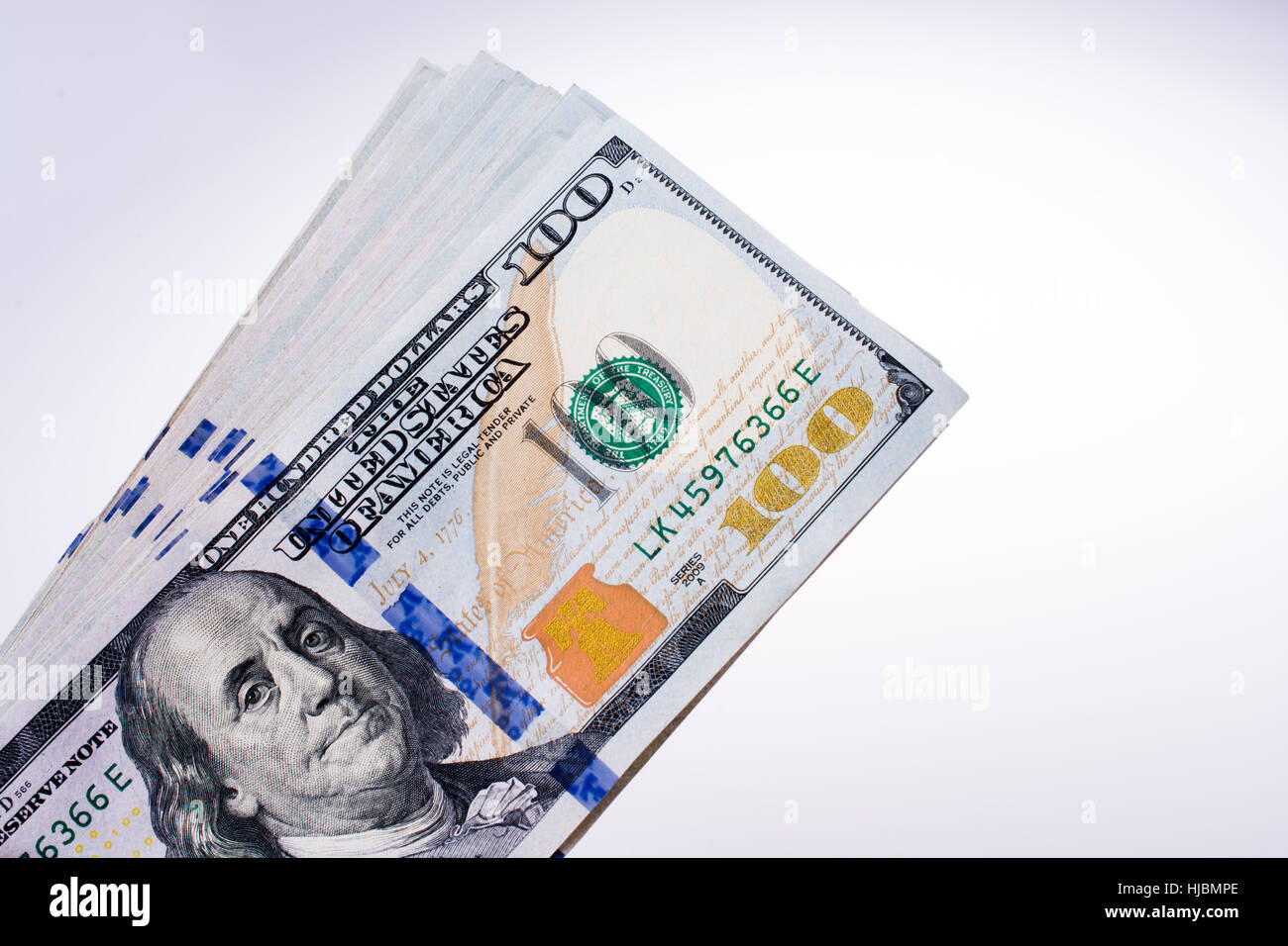 American 100 dollar banknotes made of paper placed on white background ...