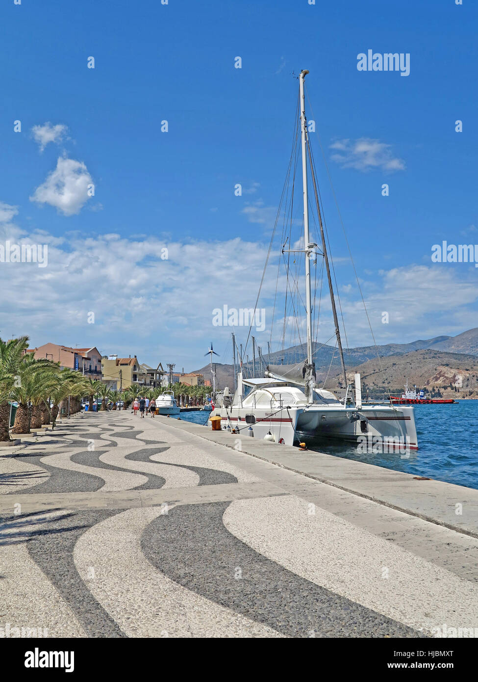 Catamaran moored along Argostoli quay seafront in Kefalonia, Greece ...
