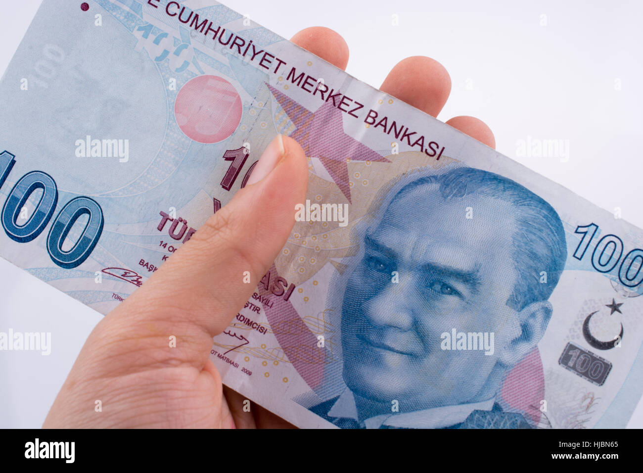 Hand holding 100 Turksh Lira banknotes on white background Stock Photo ...