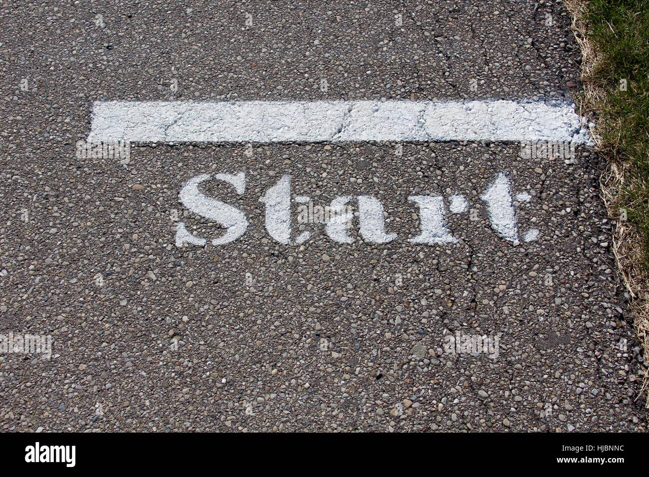 The word start painted on the sidewalk Stock Photo - Alamy