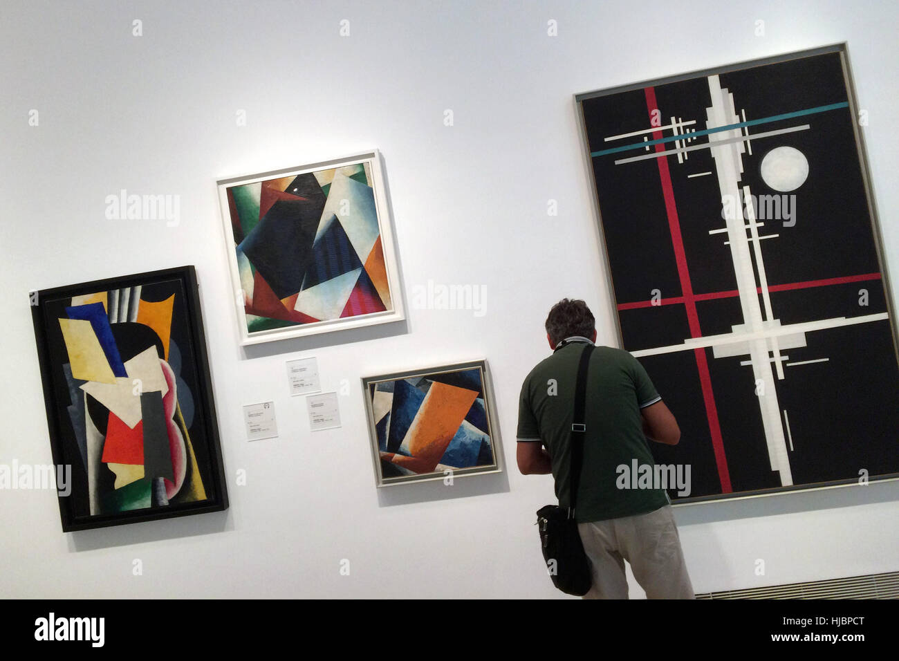 Visitor in front of the suprematist paintings by Russian avant-garde ...