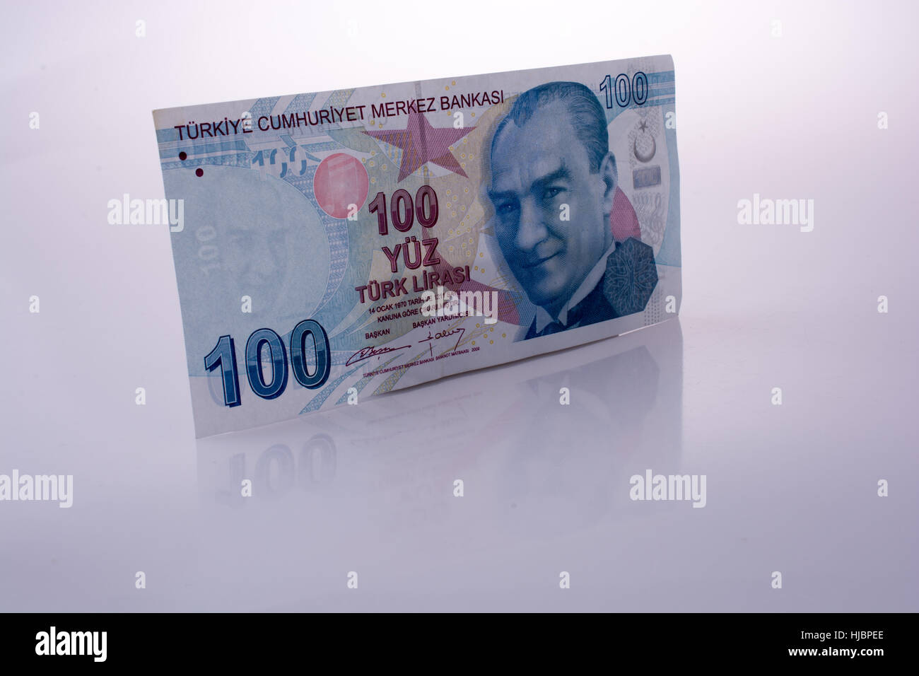 Turksh Lira banknotes of 100 Lira on white background Stock Photo - Alamy