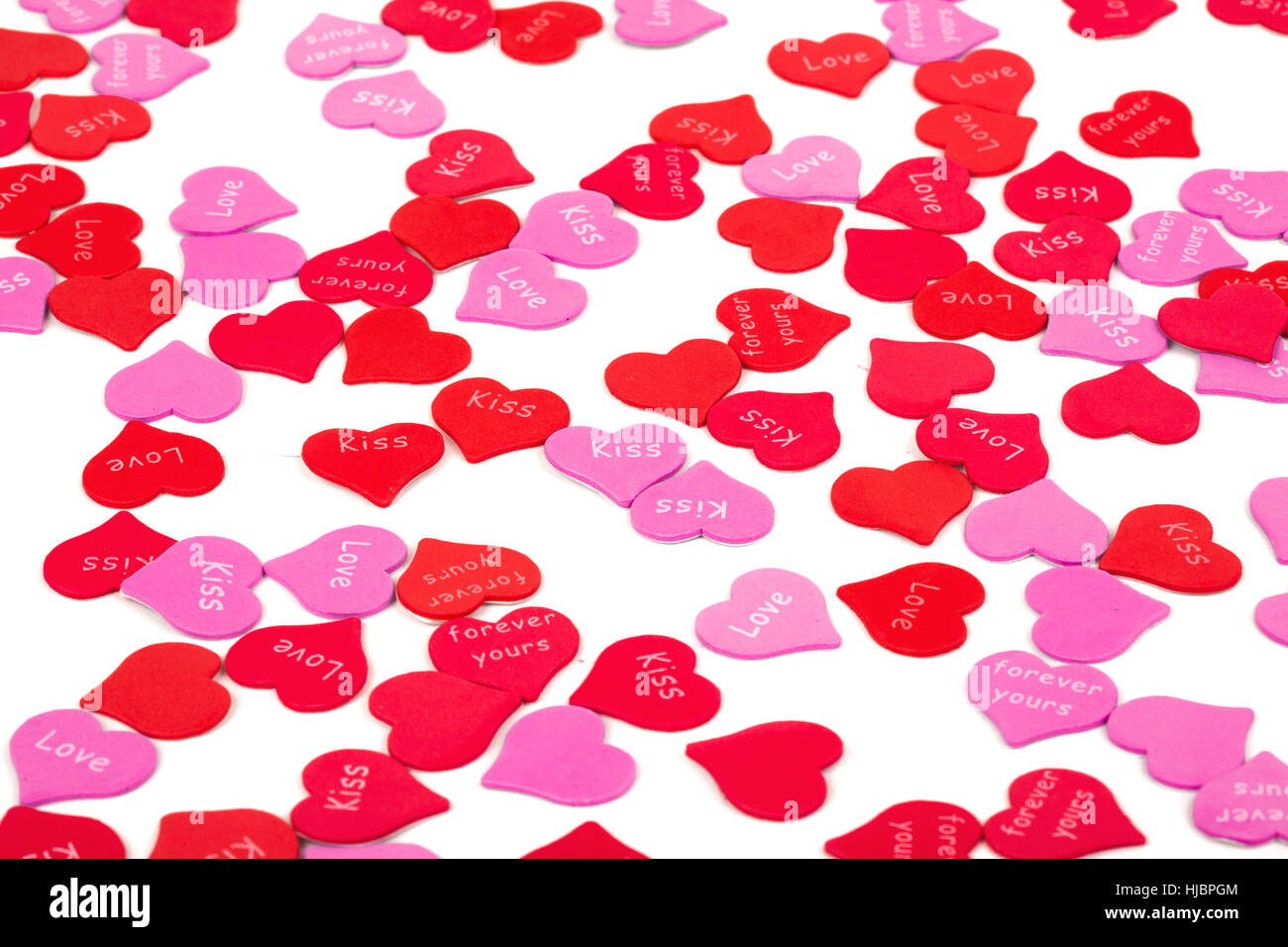 Valentines Day confetti on white background Stock Photo - Alamy
