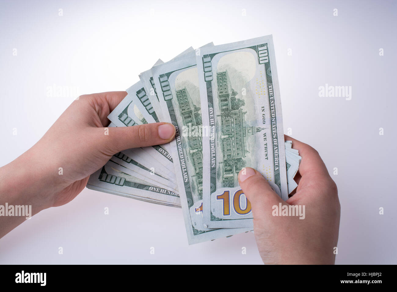 Human hand holding American dollar bill as money isolated on white ...