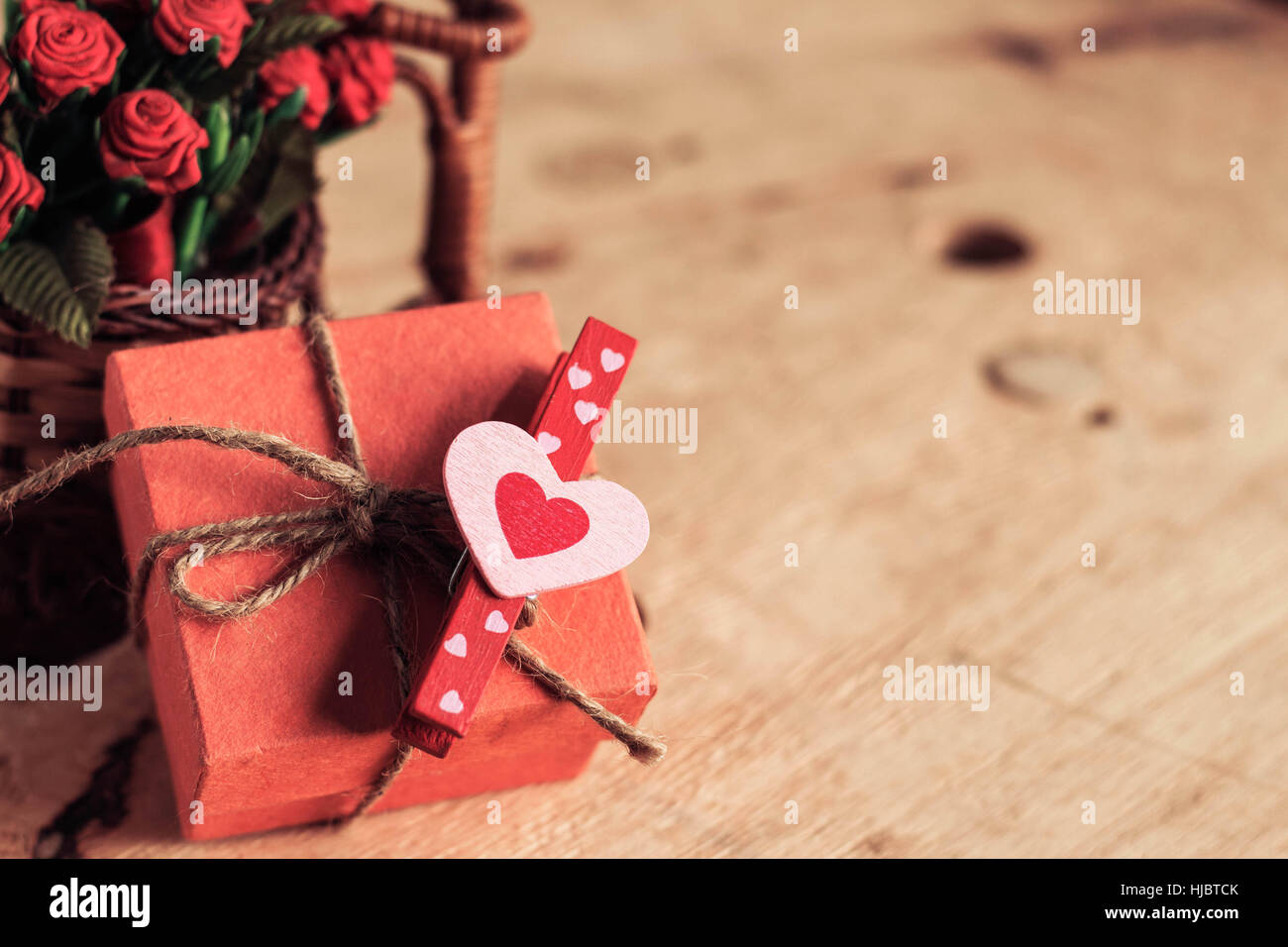 Heart-shaped on gift boxes with wooden floors Stock Photo - Alamy