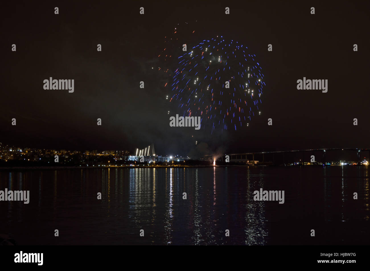 Beautiful firework on night sky in tromsoe city with bridge, cathedral ...