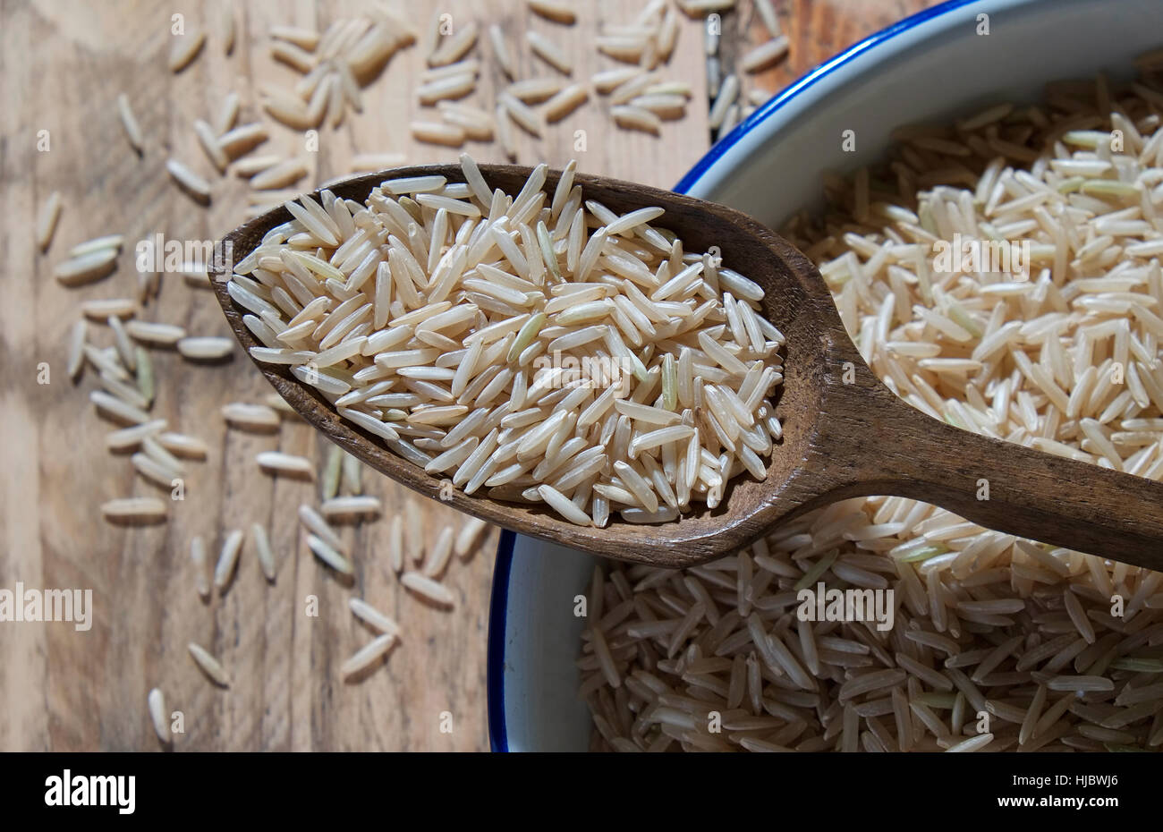 brown indian basmati rice in a white metal bowl Stock Photo - Alamy