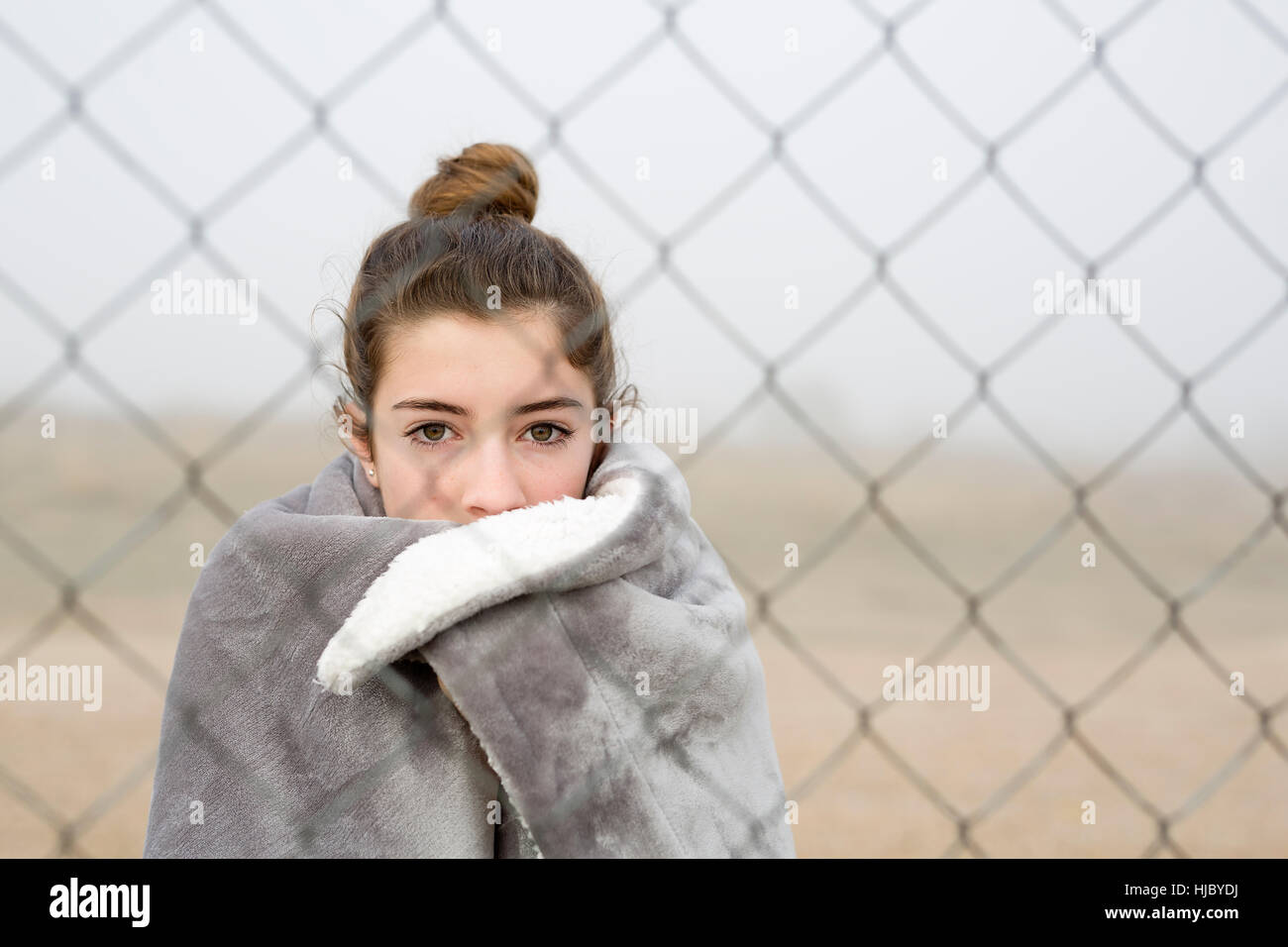 Girl behind a fence. Horizontal shot with natural light Stock Photo - Alamy