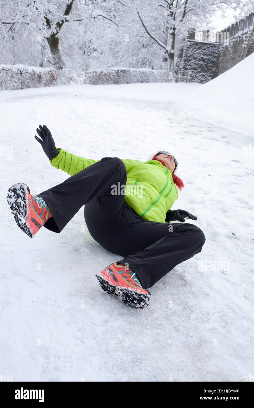Woman slipped on a snow and ice Stock Photo - Alamy