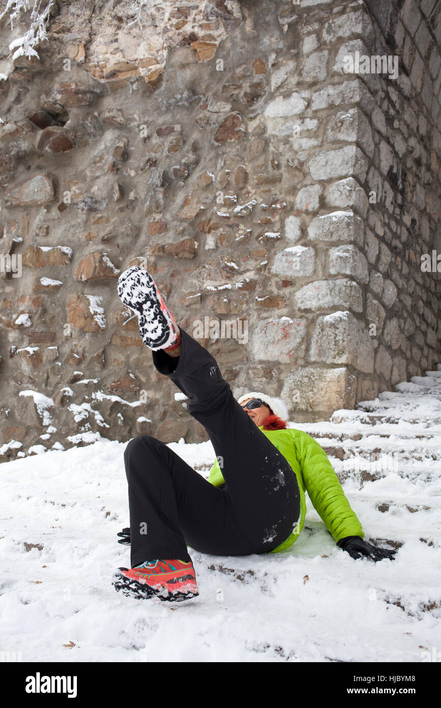 Woman slipped on a snow and ice Stock Photo - Alamy