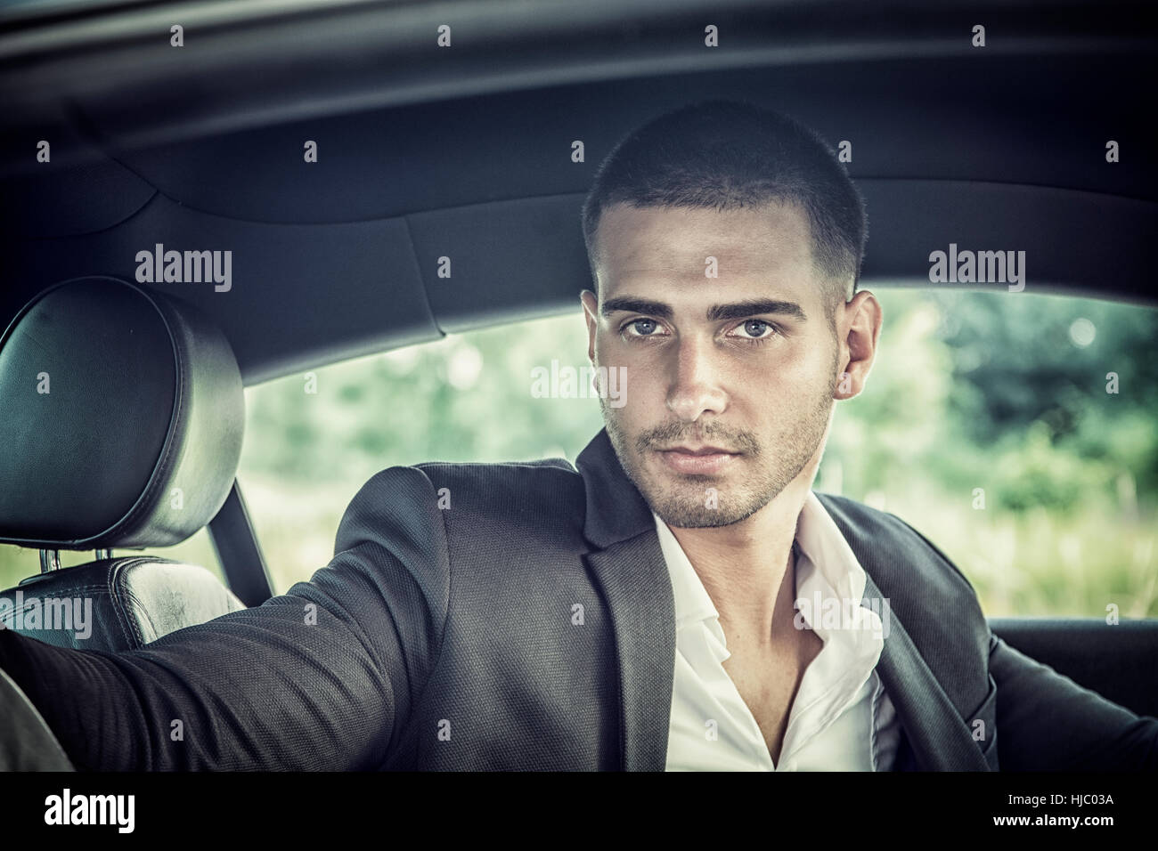 Handsome Young Man Driving a Car Stock Photo - Alamy