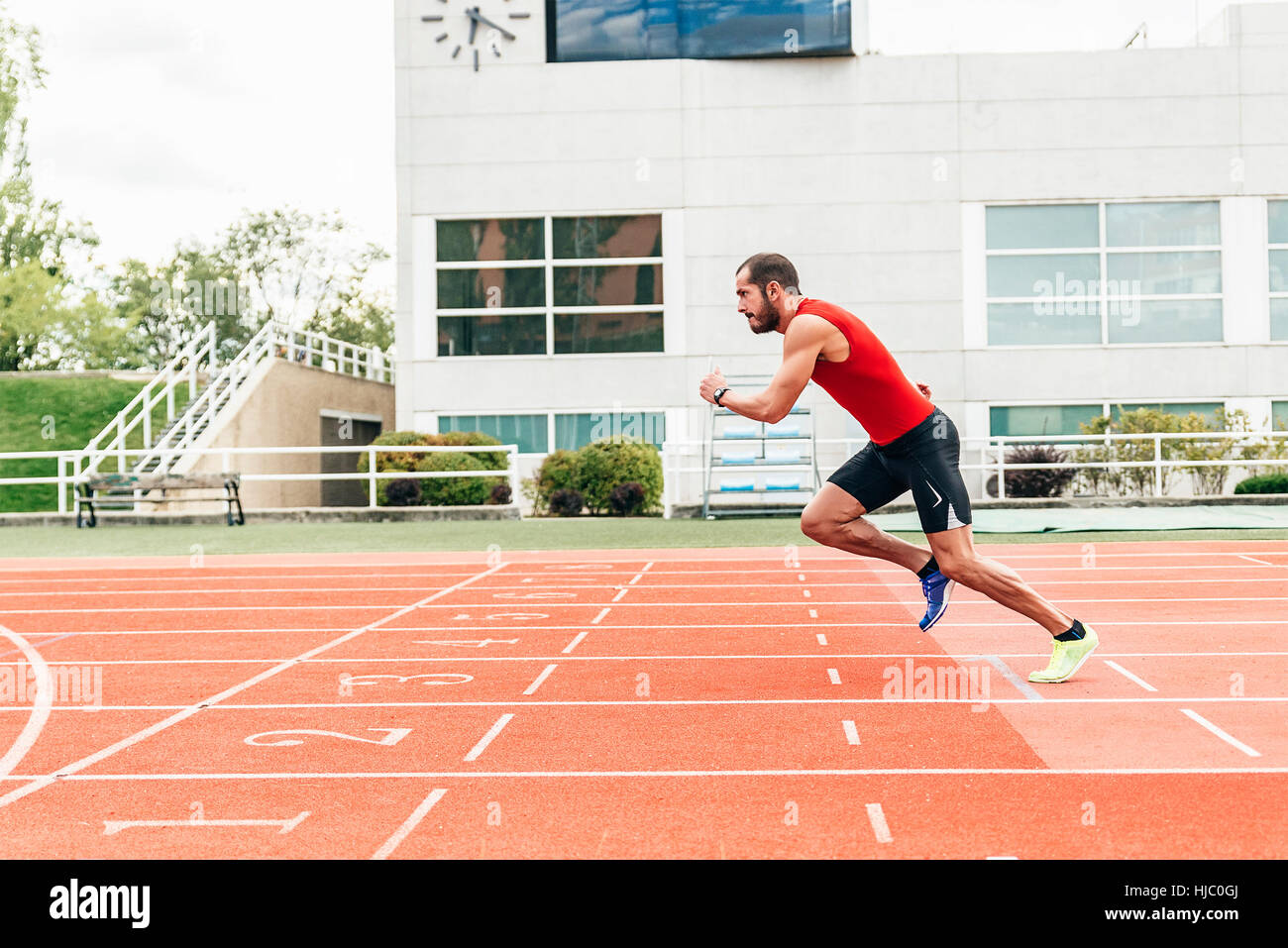 Runner ready to run is ready to run in the racetrack Stock Photo - Alamy