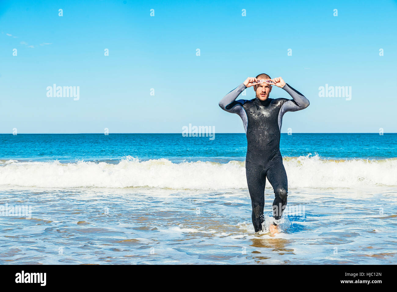 swimmer ready to go swimming in the sea Stock Photo - Alamy