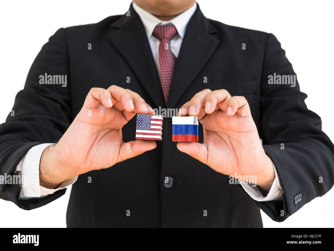 double flag on wood block in businessman hand on isolate - can use to ...