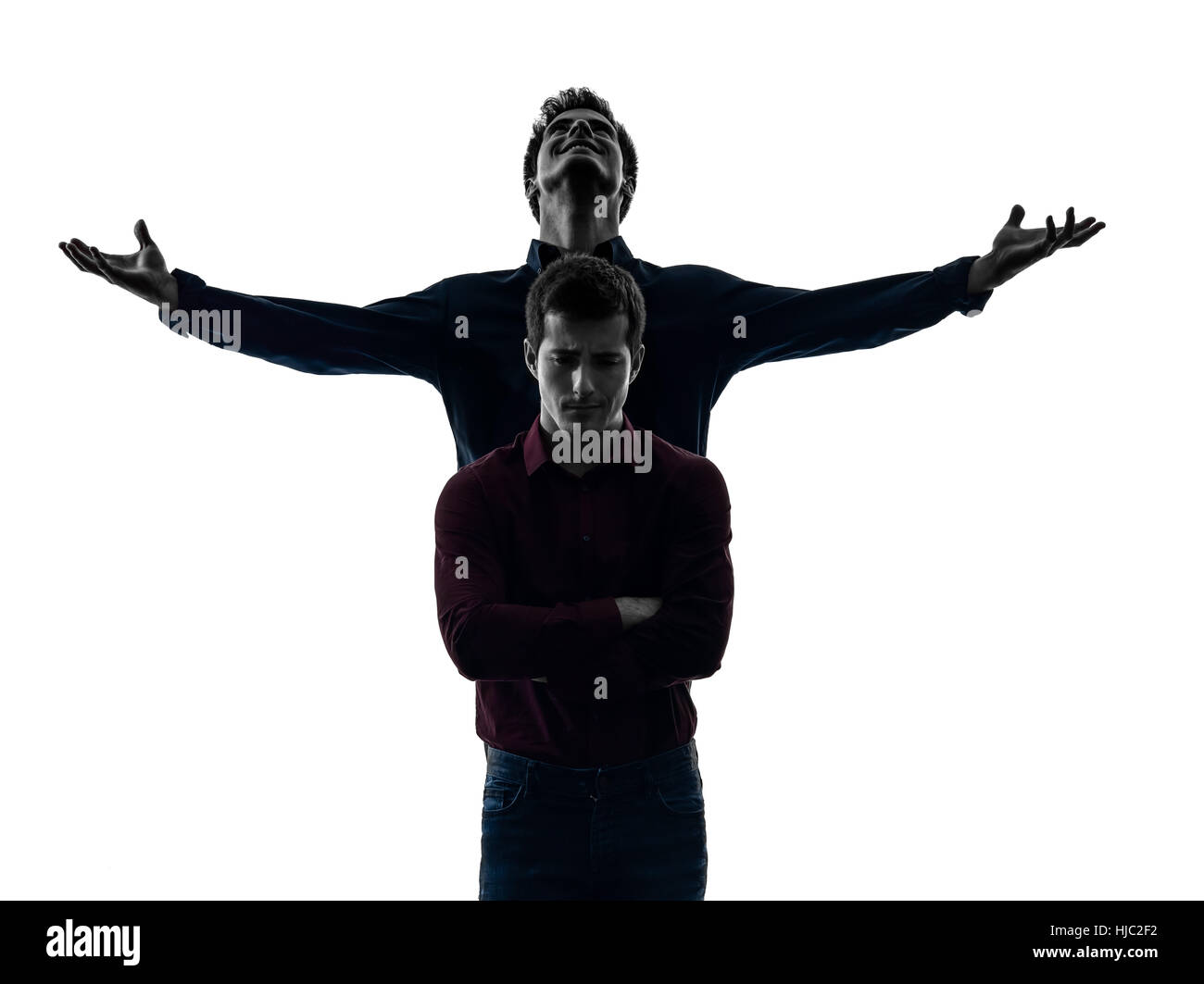 two caucasian young men domination concept shadow white background ...