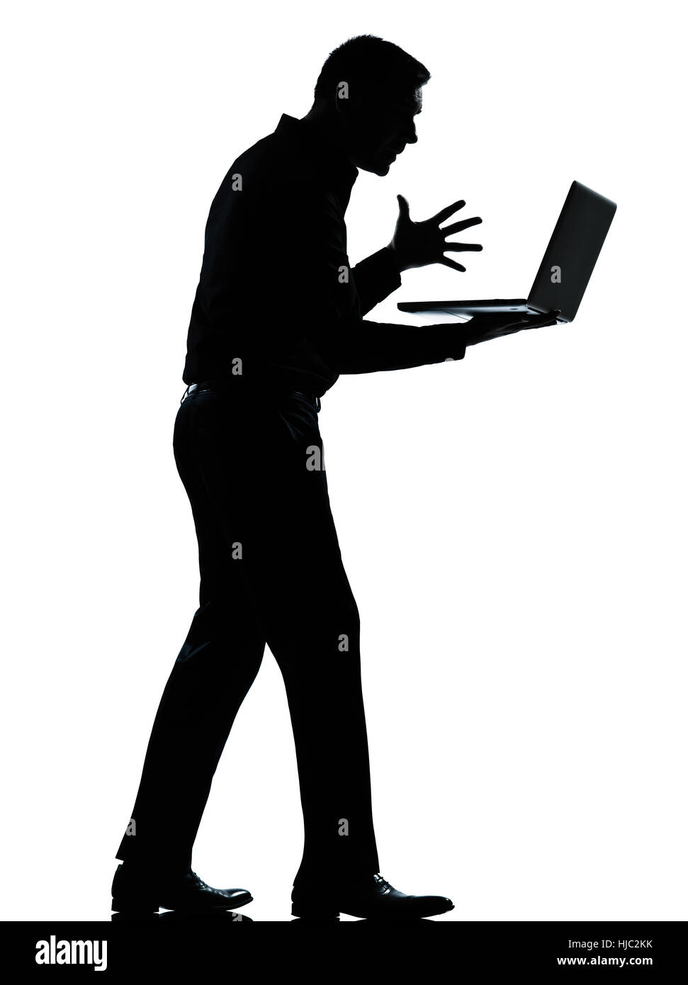 one caucasian business man computing computer laptop angry displeased ...