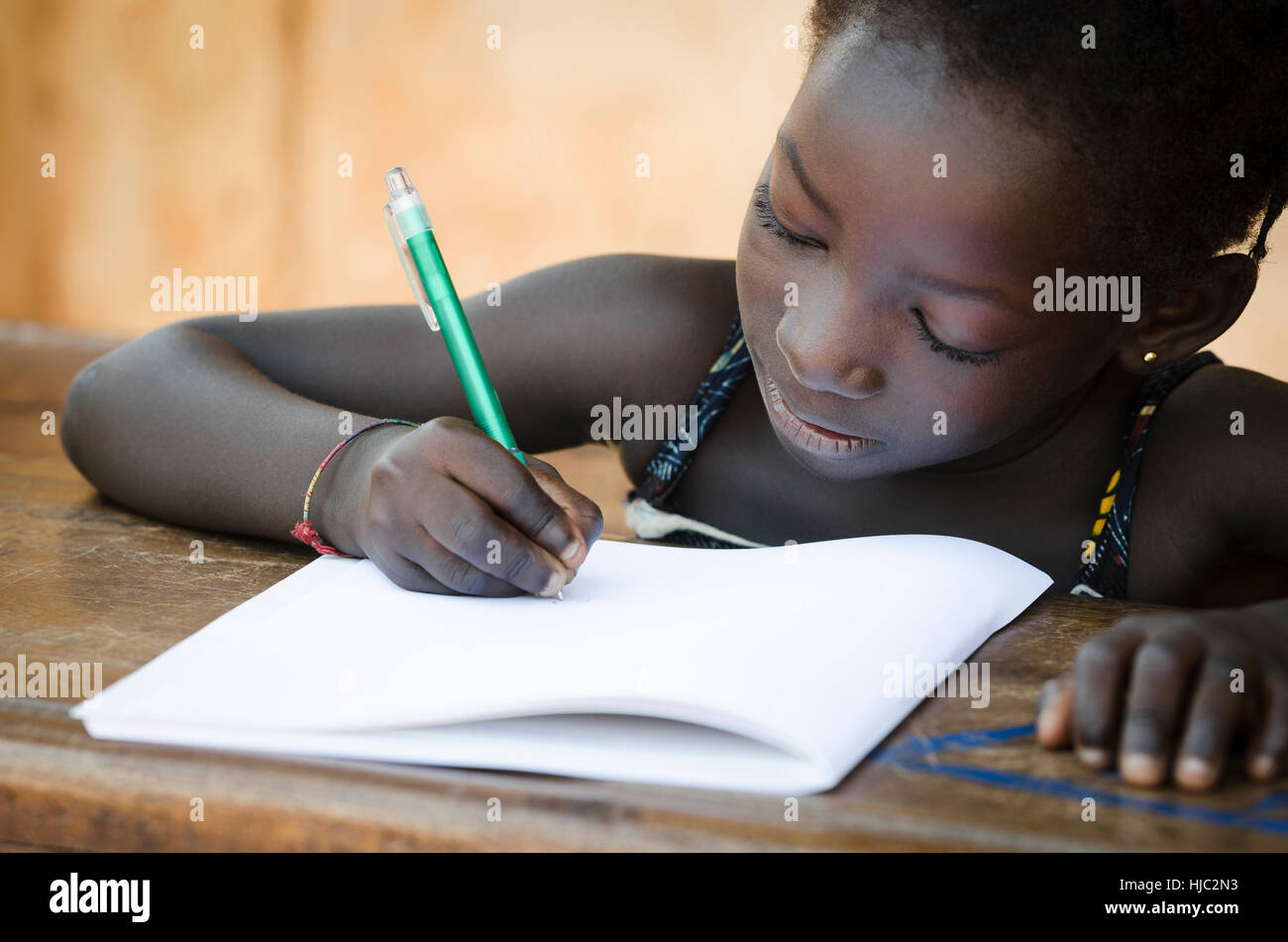 Schooling Symbol - African Young Girl Writing Notes (Real People Stock ...