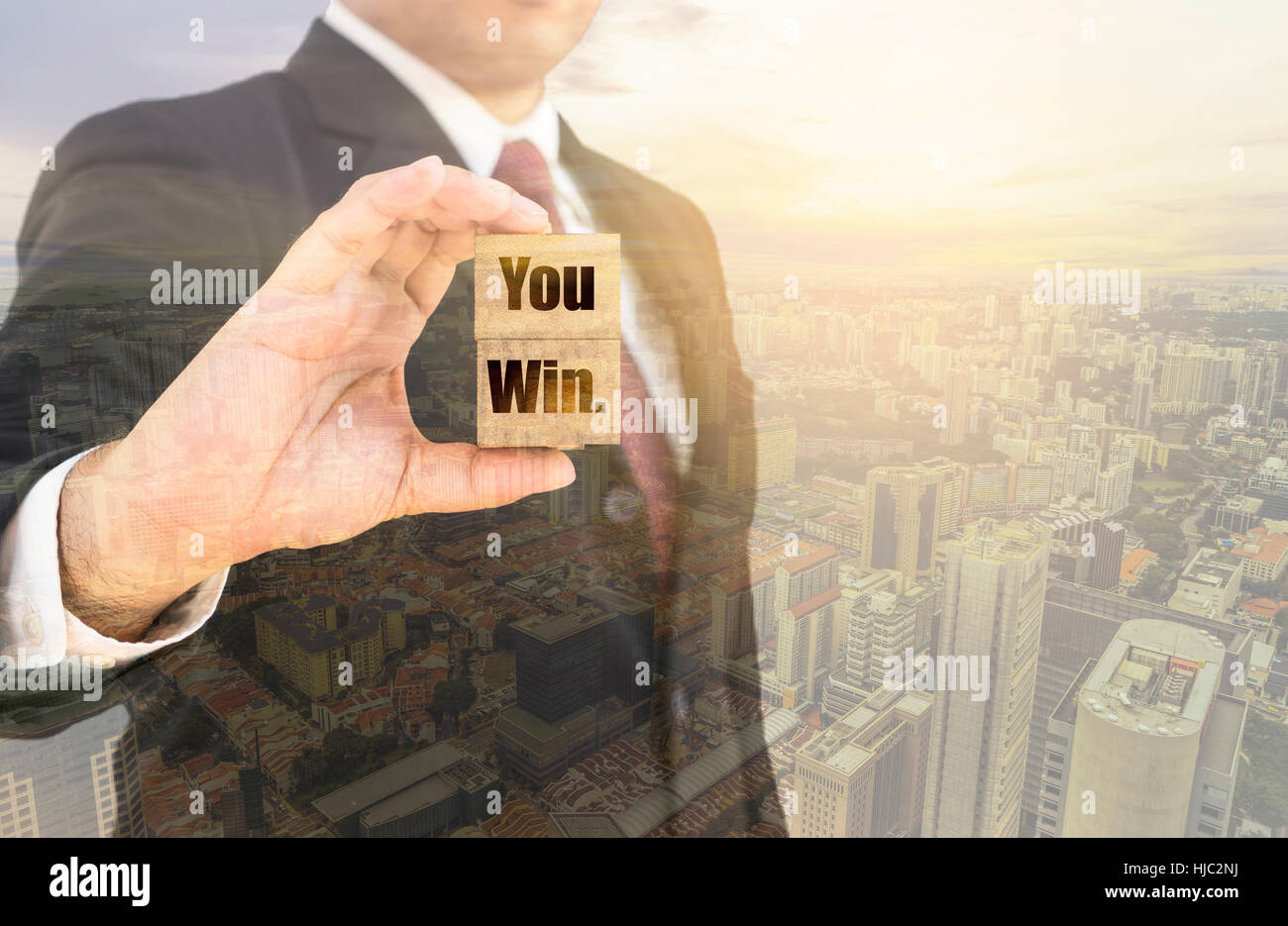 abstract double exposure businessman show word you win on wood block ...