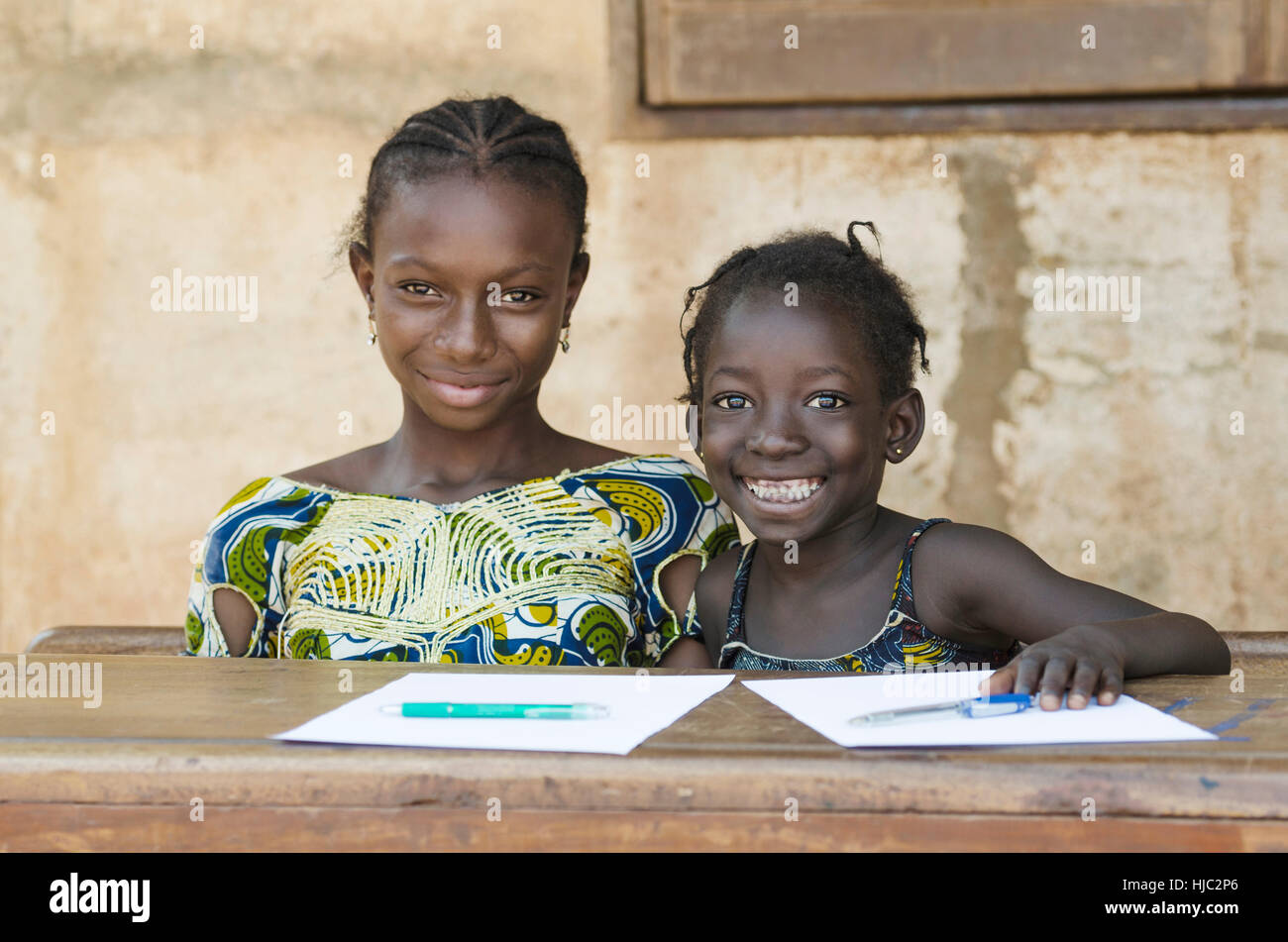 Two African Ethnicity Children Smiling Studying in a School Environment ...