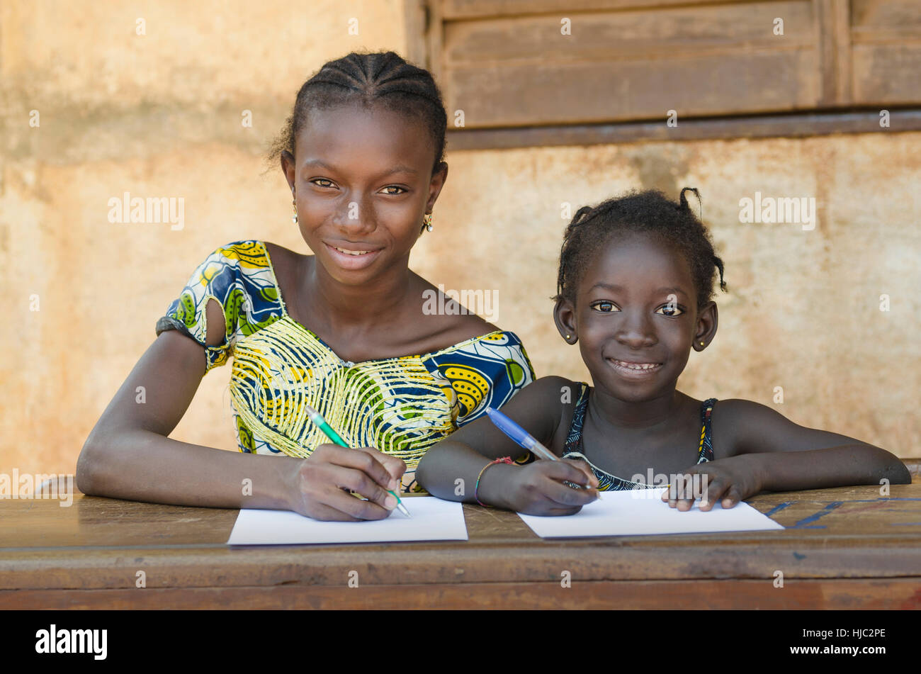 Two girls laughing classroom hi-res stock photography and images - Alamy