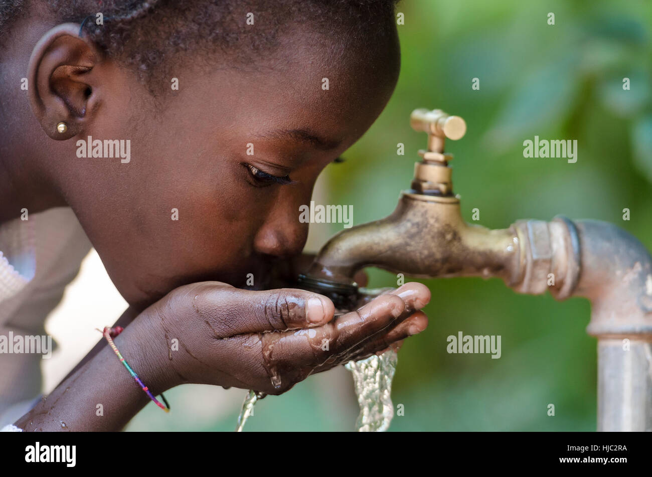 African Woman Drinking Water