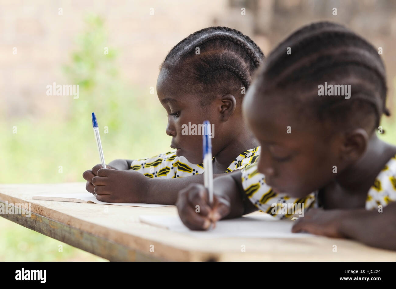 African Children at School Doing Homework. African ethnicity students ...