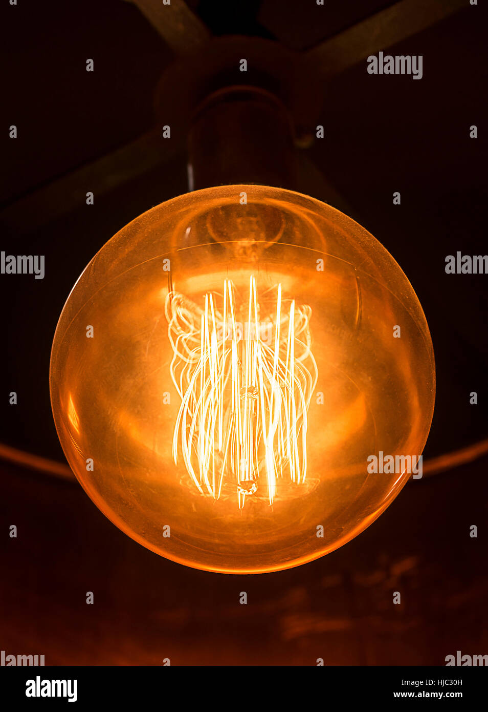 Big lightbulb producing light Stock Photo - Alamy
