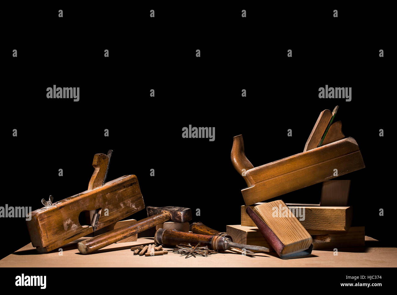 Wooden carpenter tools background isolated on black Stock Photo - Alamy