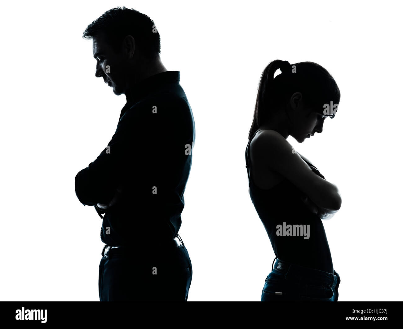 one man and teenager girl dispute conflict in silhouette indoors ...