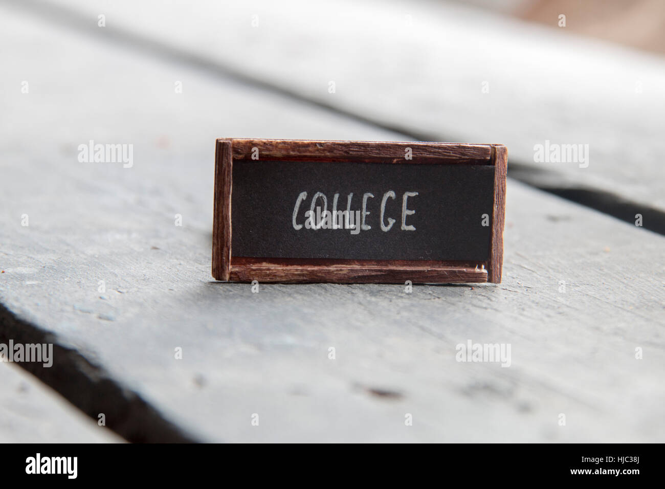 college tag on an old retro table Stock Photo - Alamy