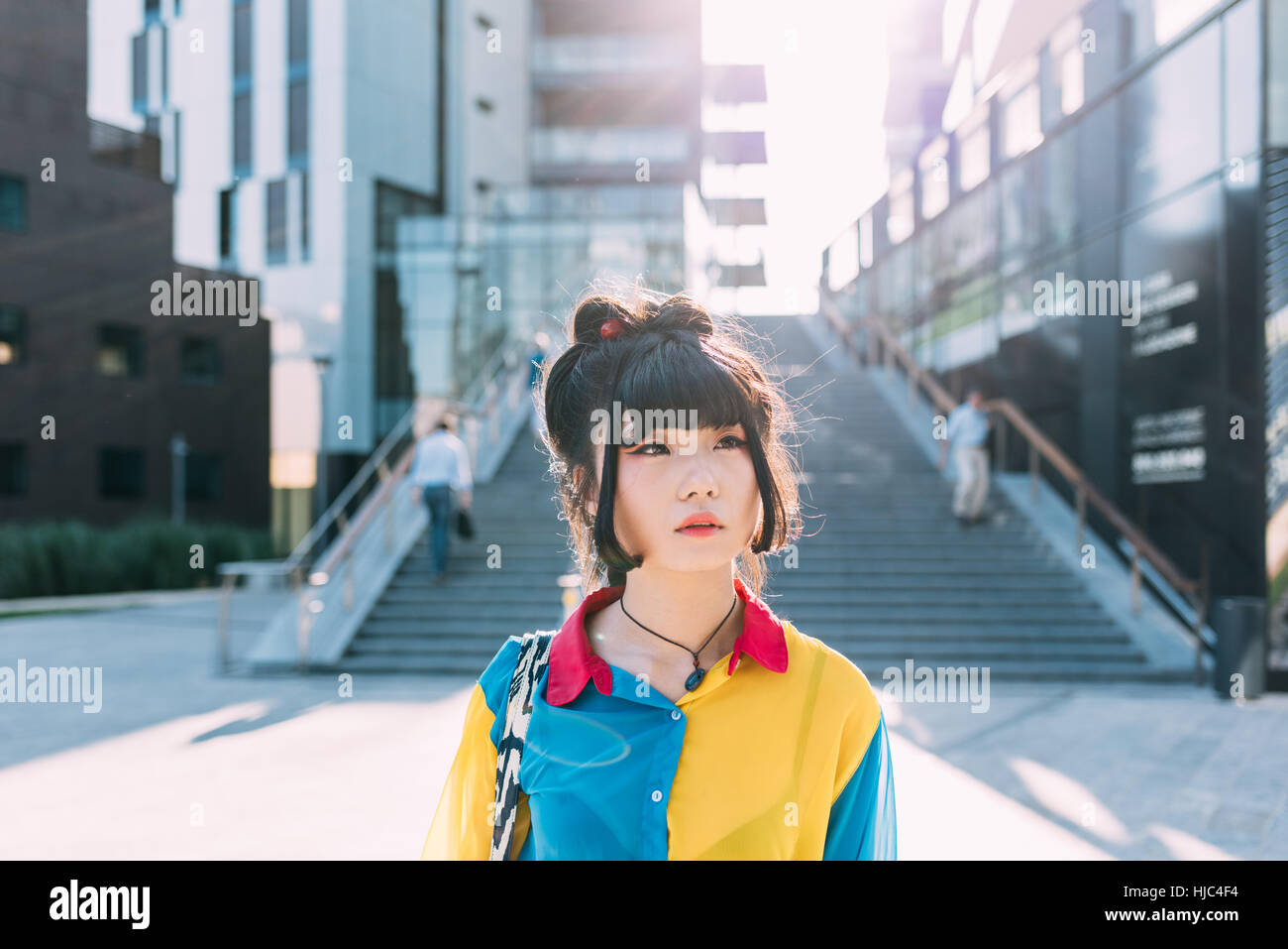 Half length portrait of young beautiful asian millennial woman outdoor ...