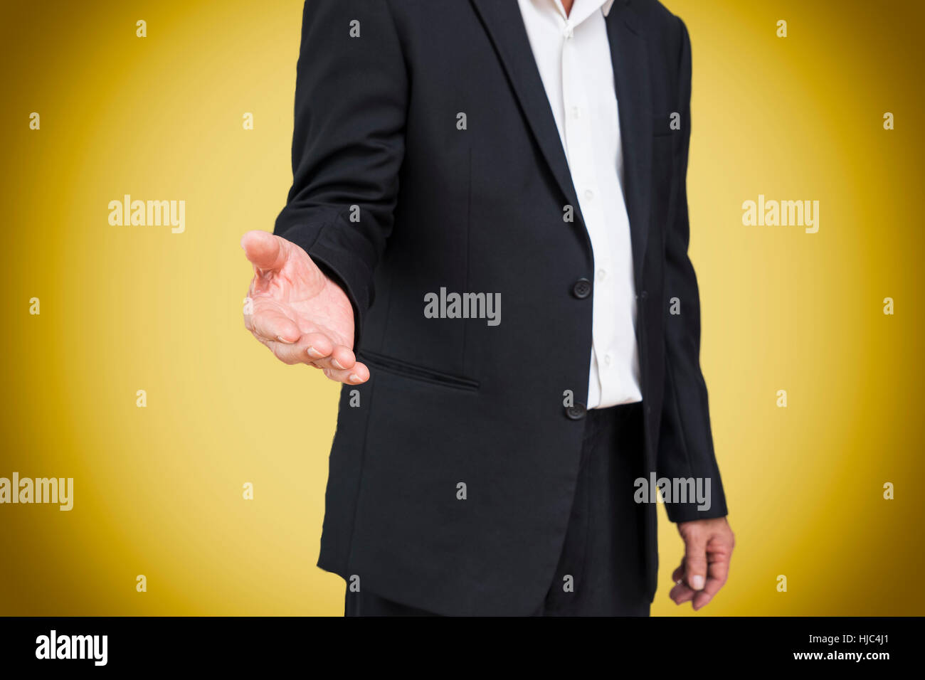 abstract businessman give a change on yellow background - can use to ...