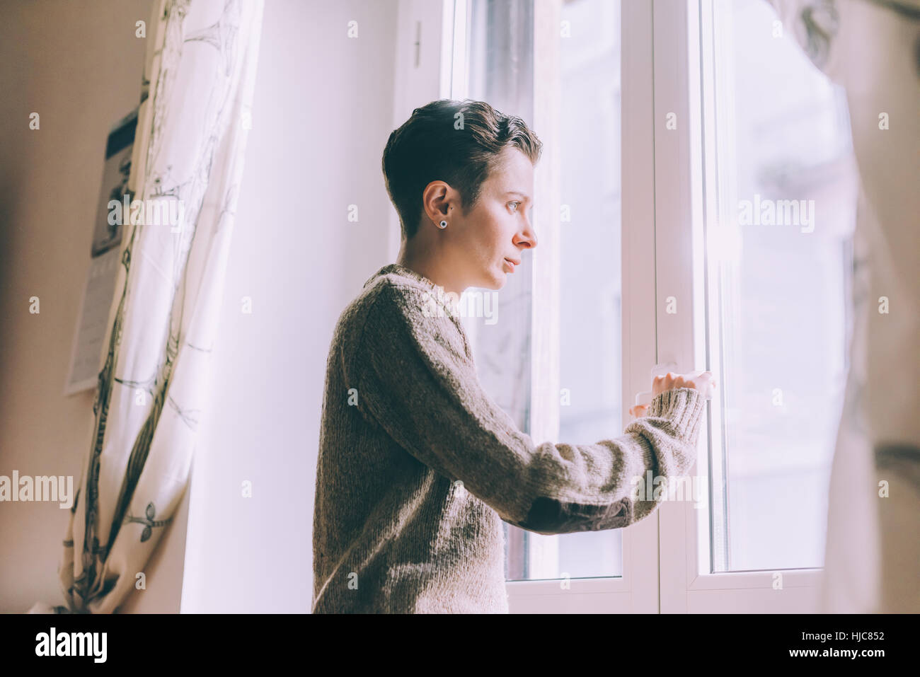 Person staring at the window hi-res stock photography and images - Alamy