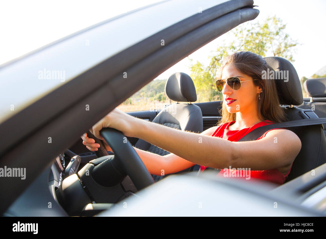 Woman driving convertible hi-res stock photography and images - Alamy