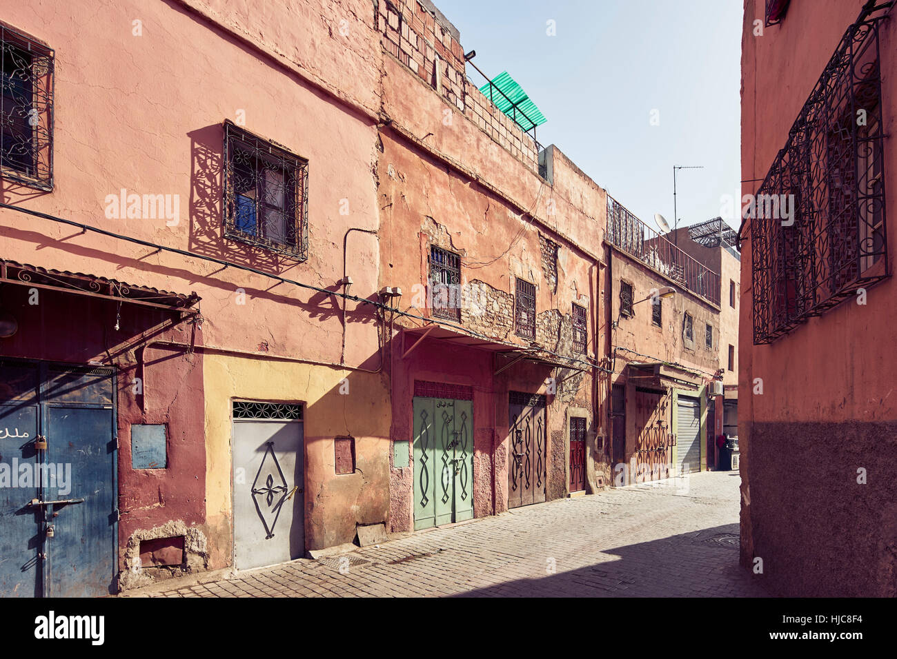 Cobbled street and traditional buildings, Marrakech, Morocco Stock ...