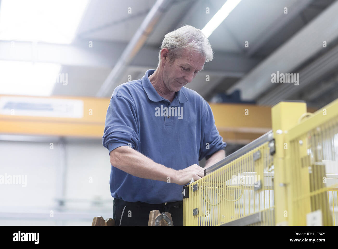 Engineer working in engineering plant Stock Photo - Alamy