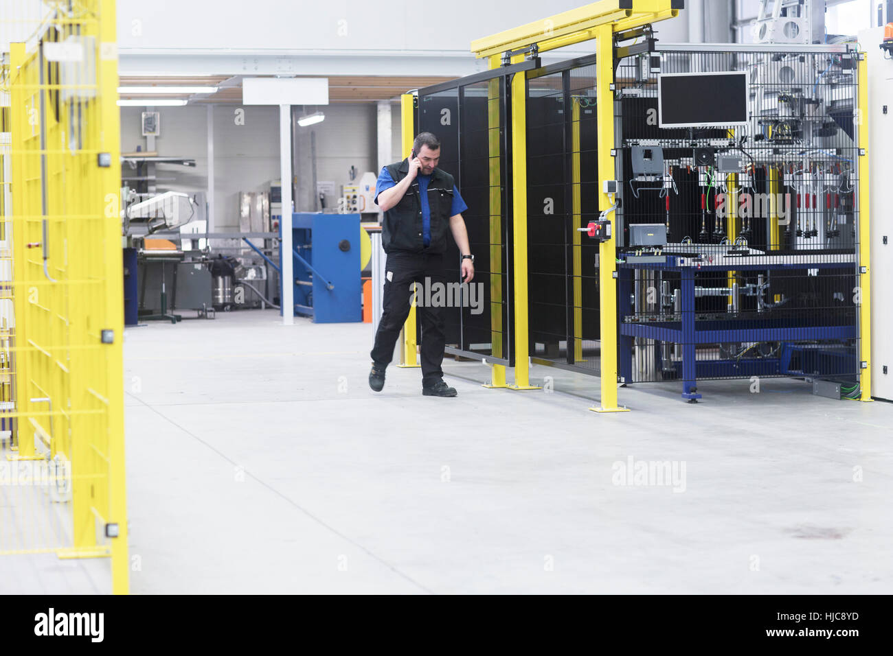 Engineer working in engineering plant Stock Photo - Alamy