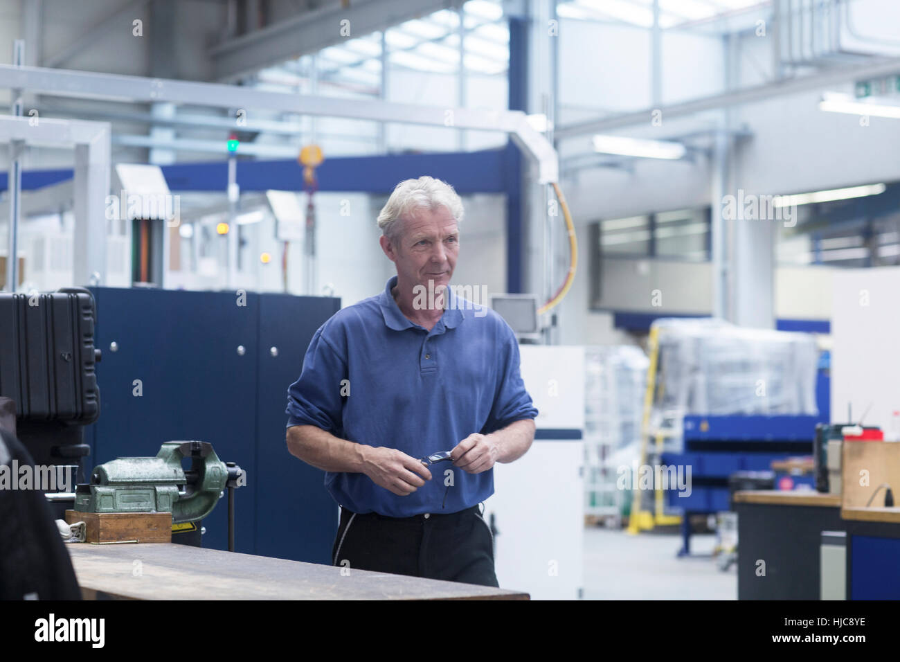 Engineer working in engineering plant Stock Photo - Alamy