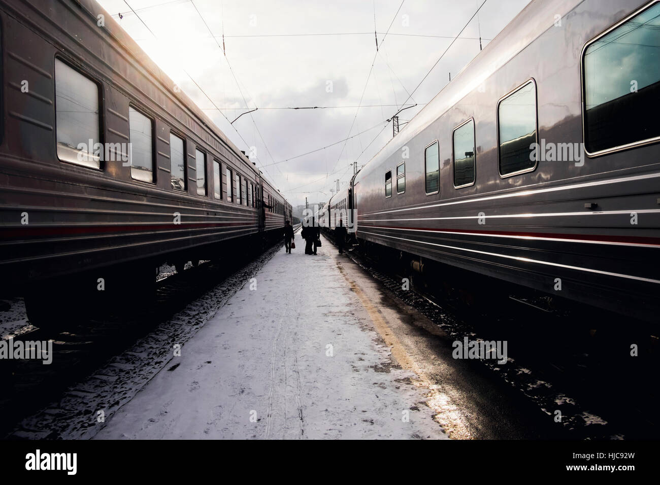 People walking between two trains, Ural, Russia Stock Photo - Alamy