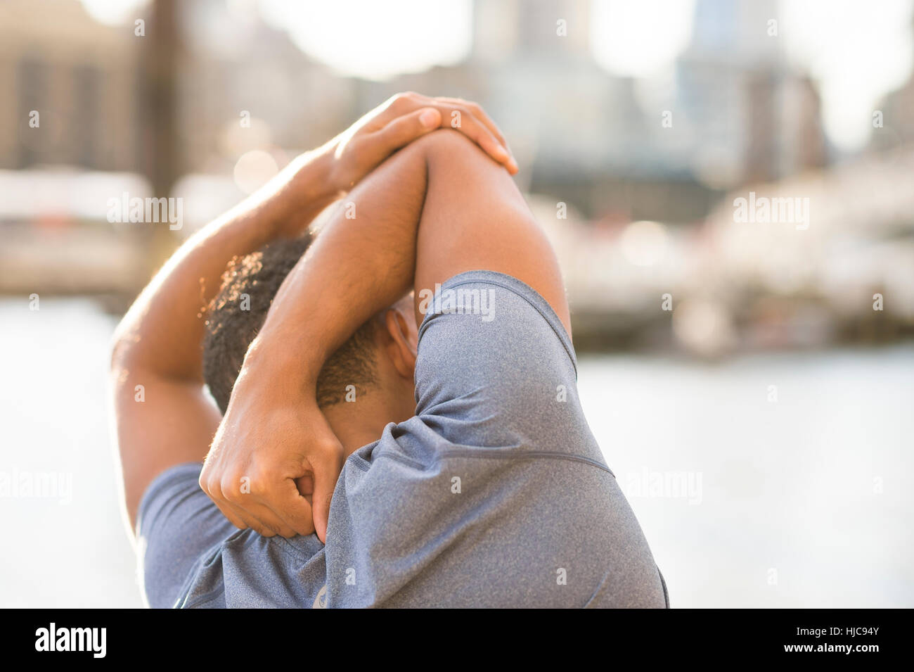 Man stretching, Wapping, London, UK Stock Photo - Alamy