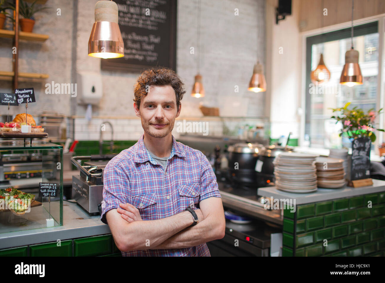 Man in front of cafe hi-res stock photography and images - Alamy