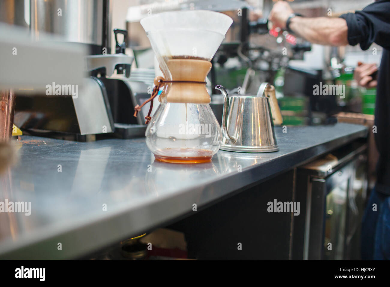 Side view male barista hi-res stock photography and images - Alamy