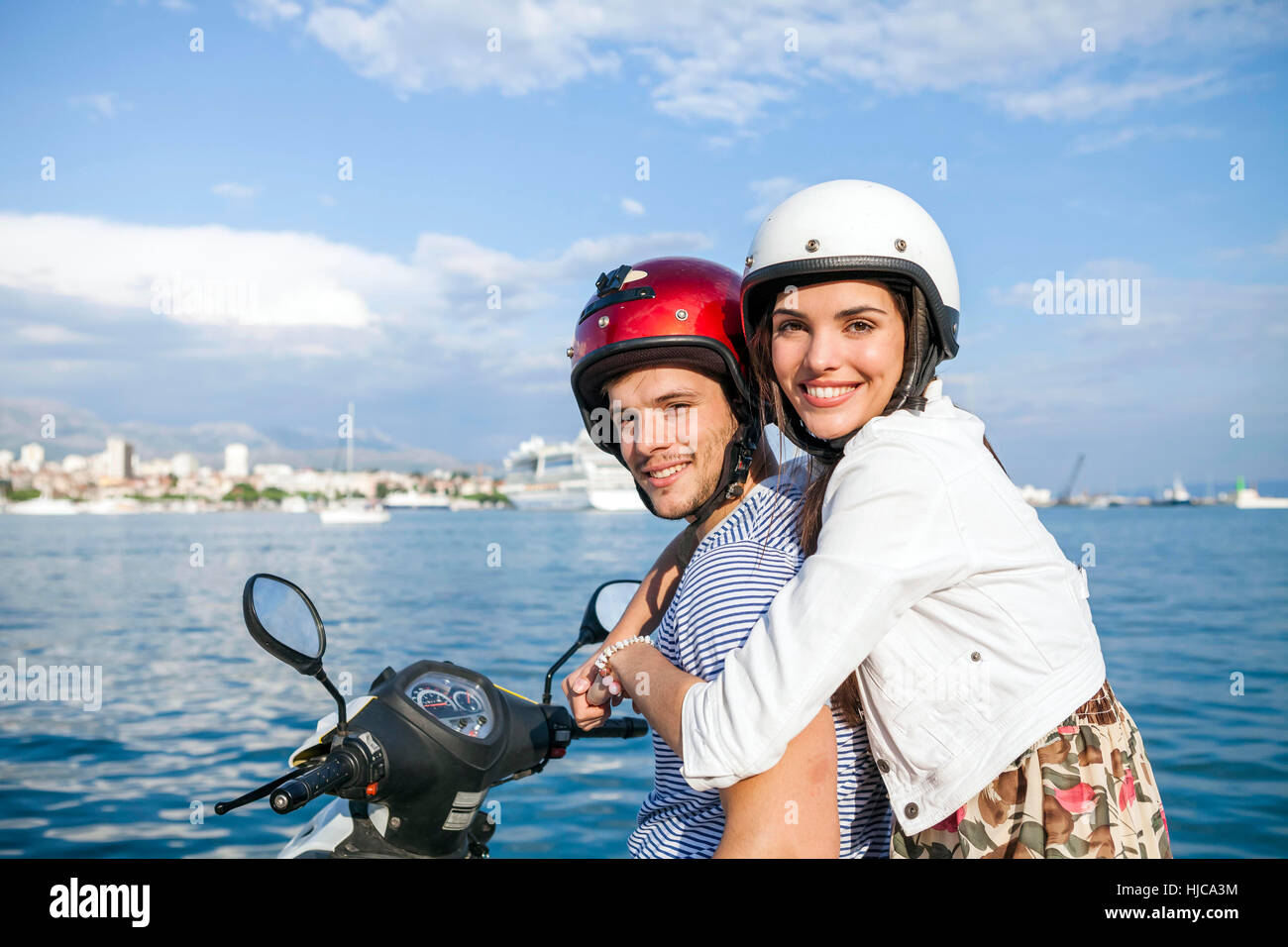 Portrait couple on moped hi-res stock photography and images - Alamy