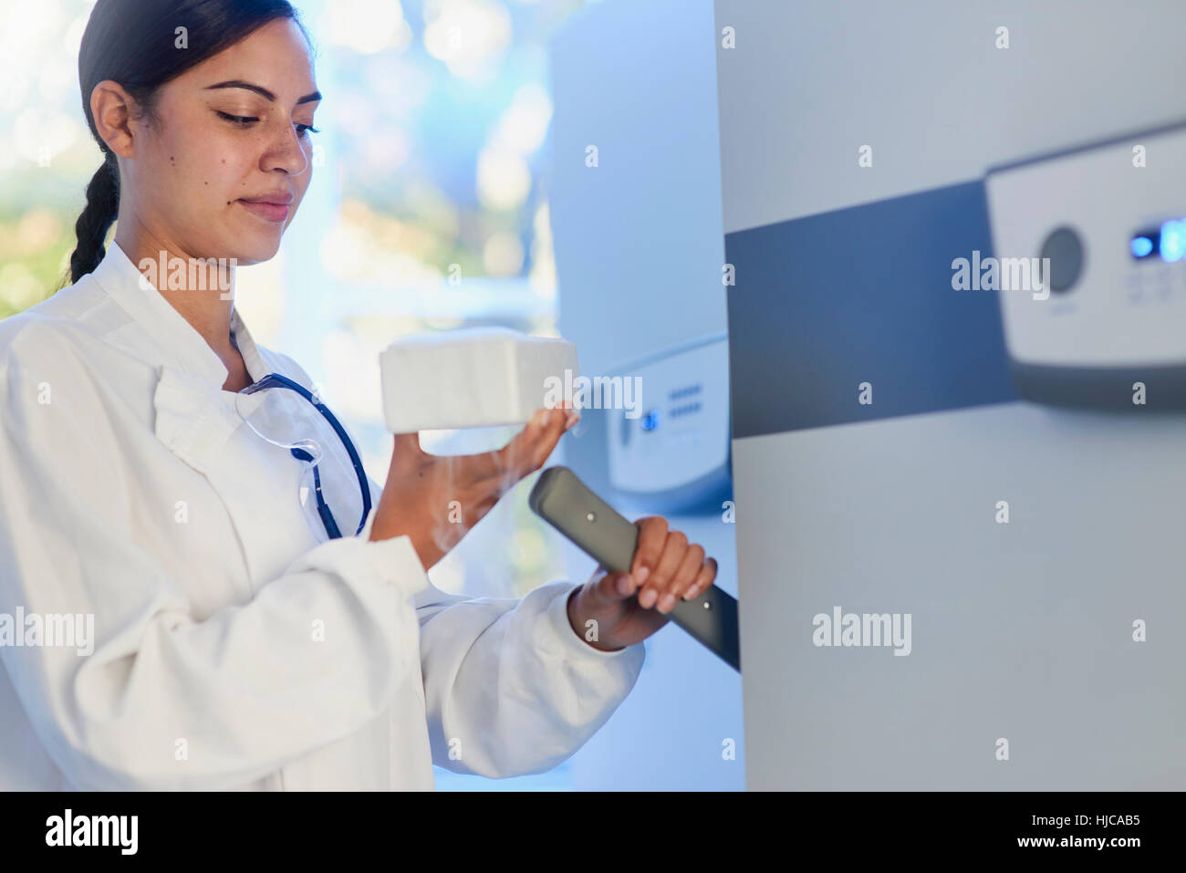 Scientist in laboratory using scientific equipment Stock Photo - Alamy